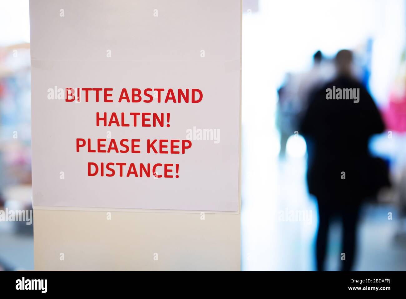 Warning sign in the supermarket to keep distance to avoid getting ...