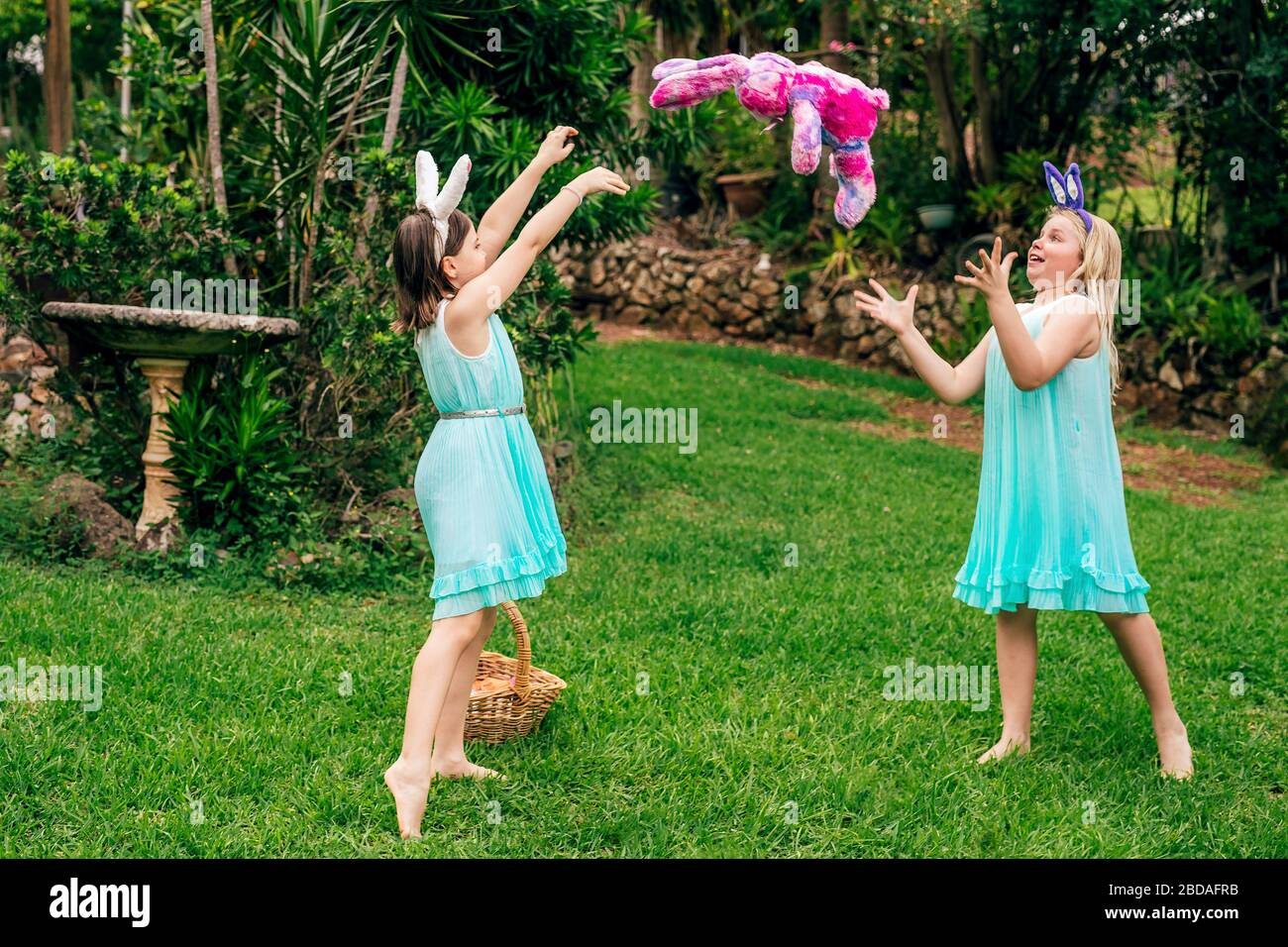 Cute little children wearing bunny ears on Easter day playing with ...