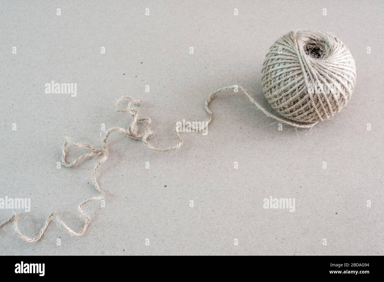 Texture of the brown natural rustic hemp cord in roll on kraft paper ...