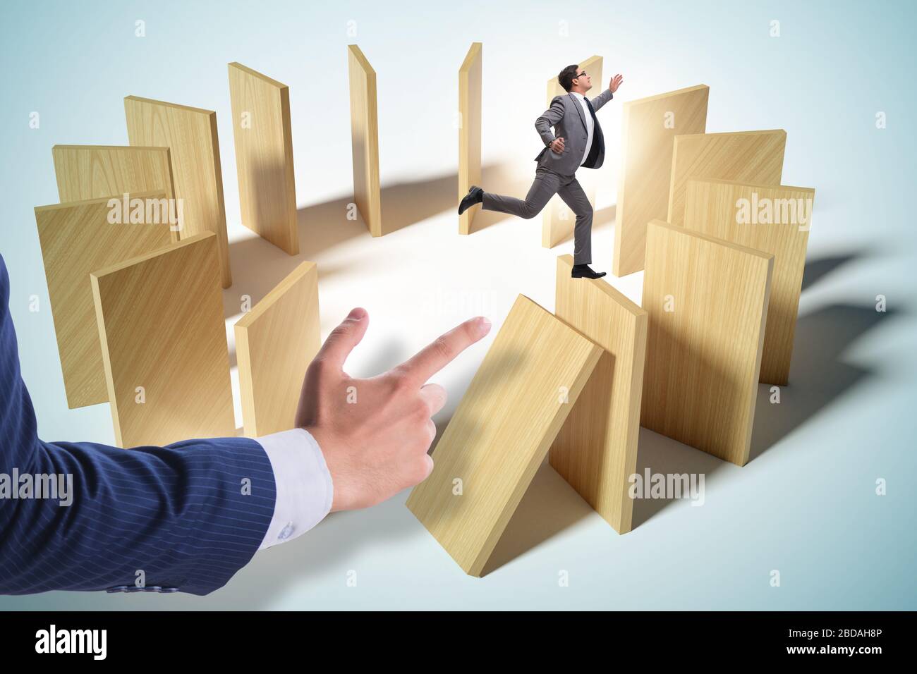 The domino effect and competition concept Stock Photo - Alamy