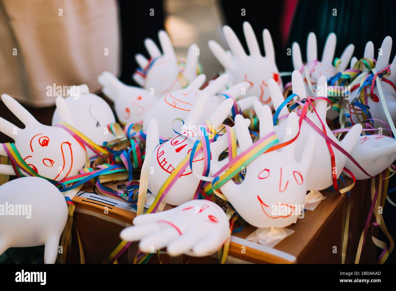 balloons in hand shape form colored at a childrens family party Stock ...