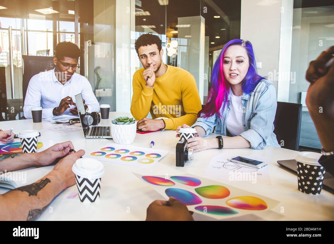 Group of multi ethnic executives discussing during a meeting. Business ...