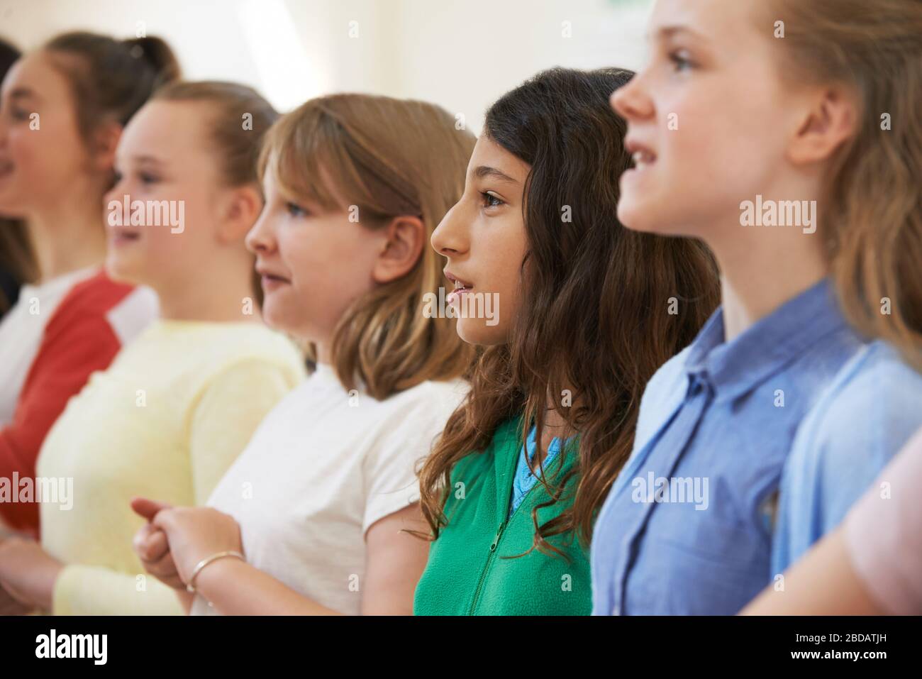 Group Of School Children Singing In Choir At Stage School Together ...