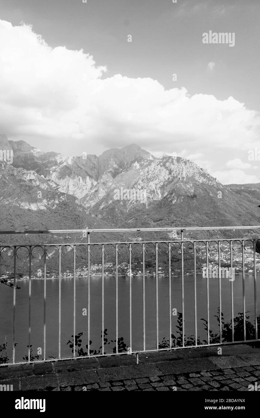 Panorama on the Italian Alps seen through a railing Stock Photo - Alamy