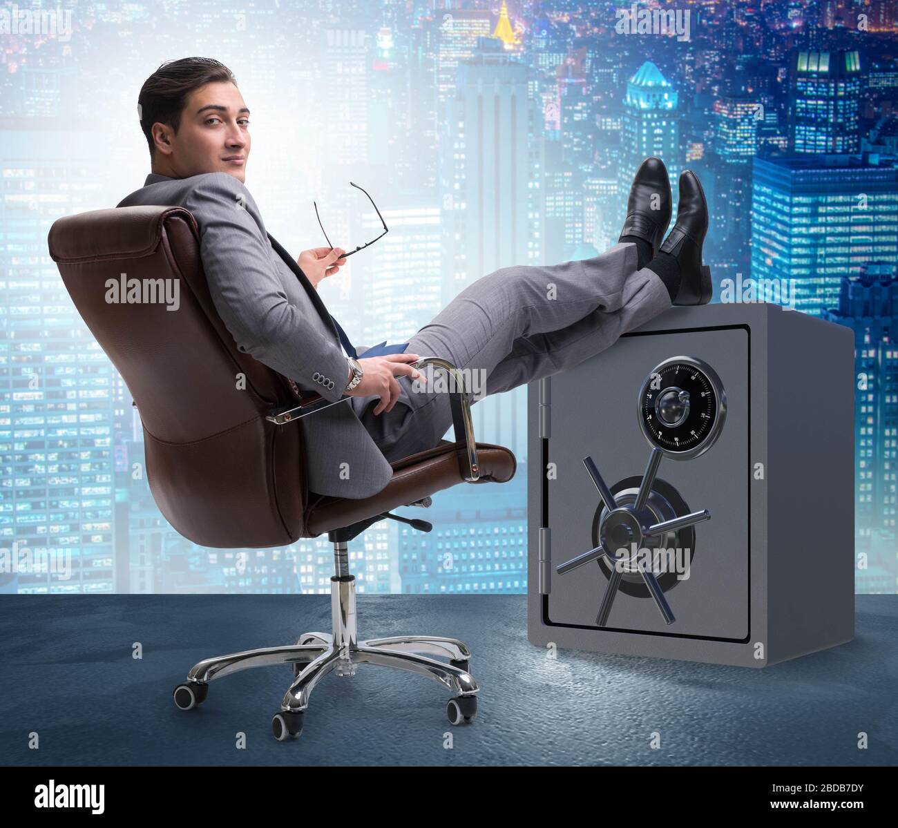 The businessman resting putting leg on safe Stock Photo - Alamy