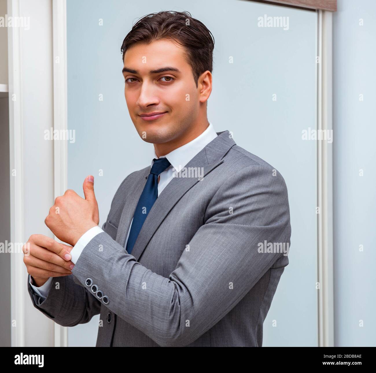 The businessman dressing up for work Stock Photo - Alamy