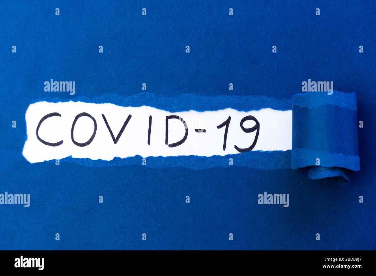 Coronavirus Covid-19 torn paper concept Stock Photo - Alamy