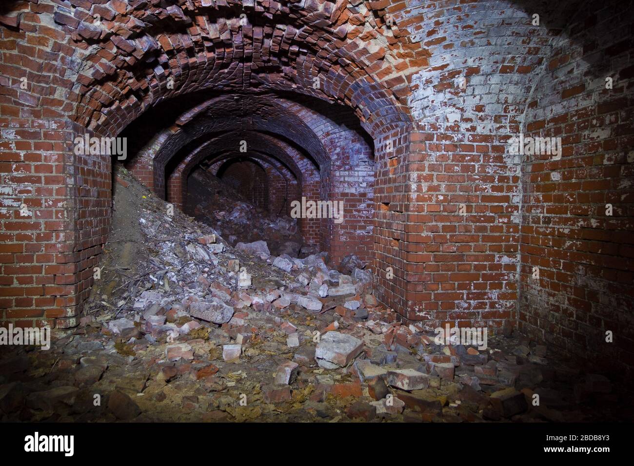 Old collapsed ruined underground red brick historical vaulted tunnel ...