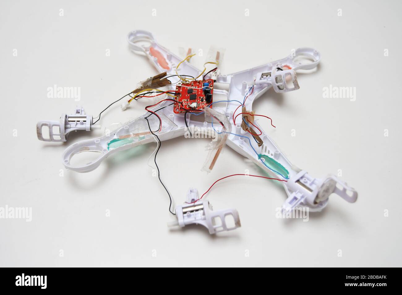 White crashed broken drone Stock Photo - Alamy