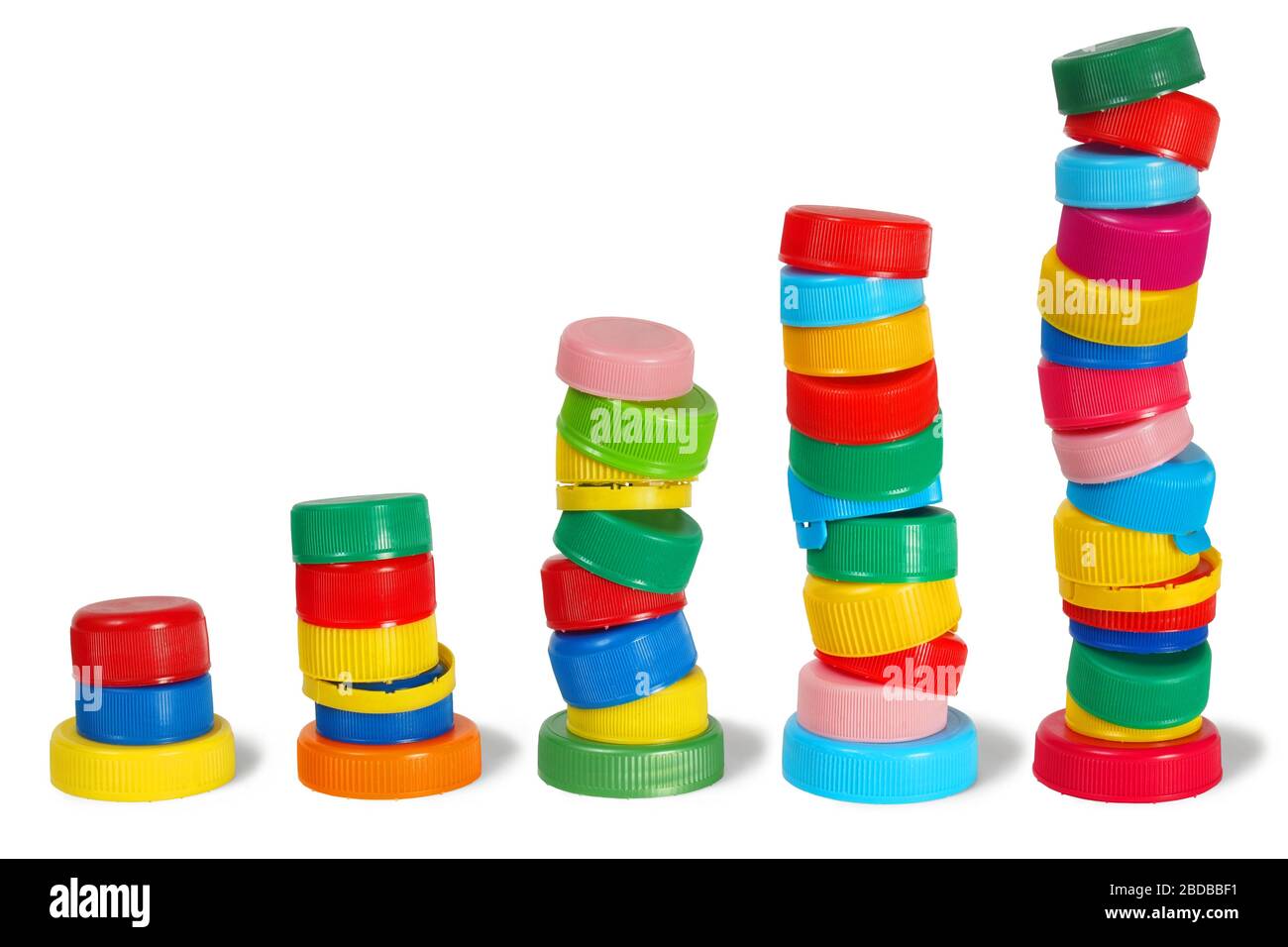 Stacks made from bottle caps on white background Stock Photo - Alamy