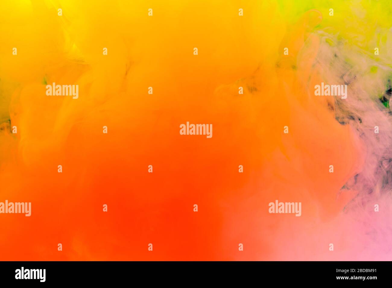 orange color dissolve in water mixed with other colors Stock Photo - Alamy