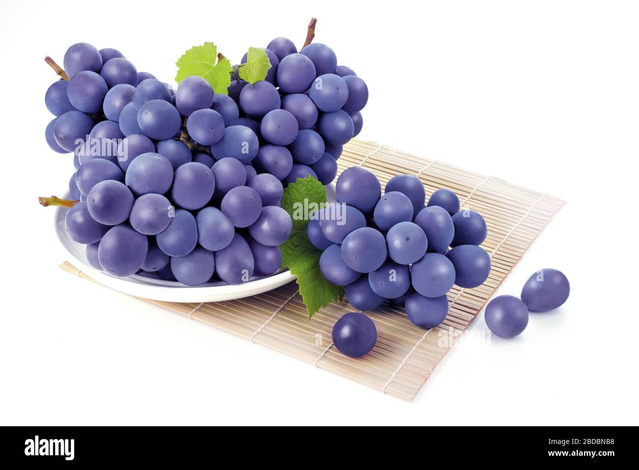 Grapes on the bamboo sheet Stock Photo - Alamy