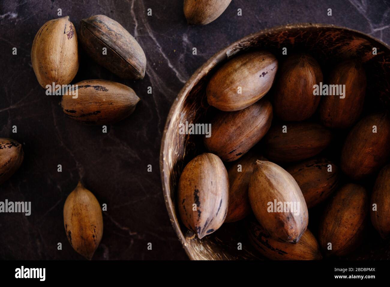 Fresh Pecan Nuts with husks Stock Photo - Alamy