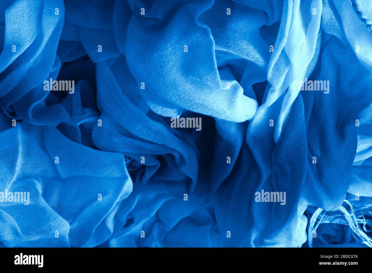 Texture of classic blue Wrinkled Fabric. Trendy color of clothes. Close ...