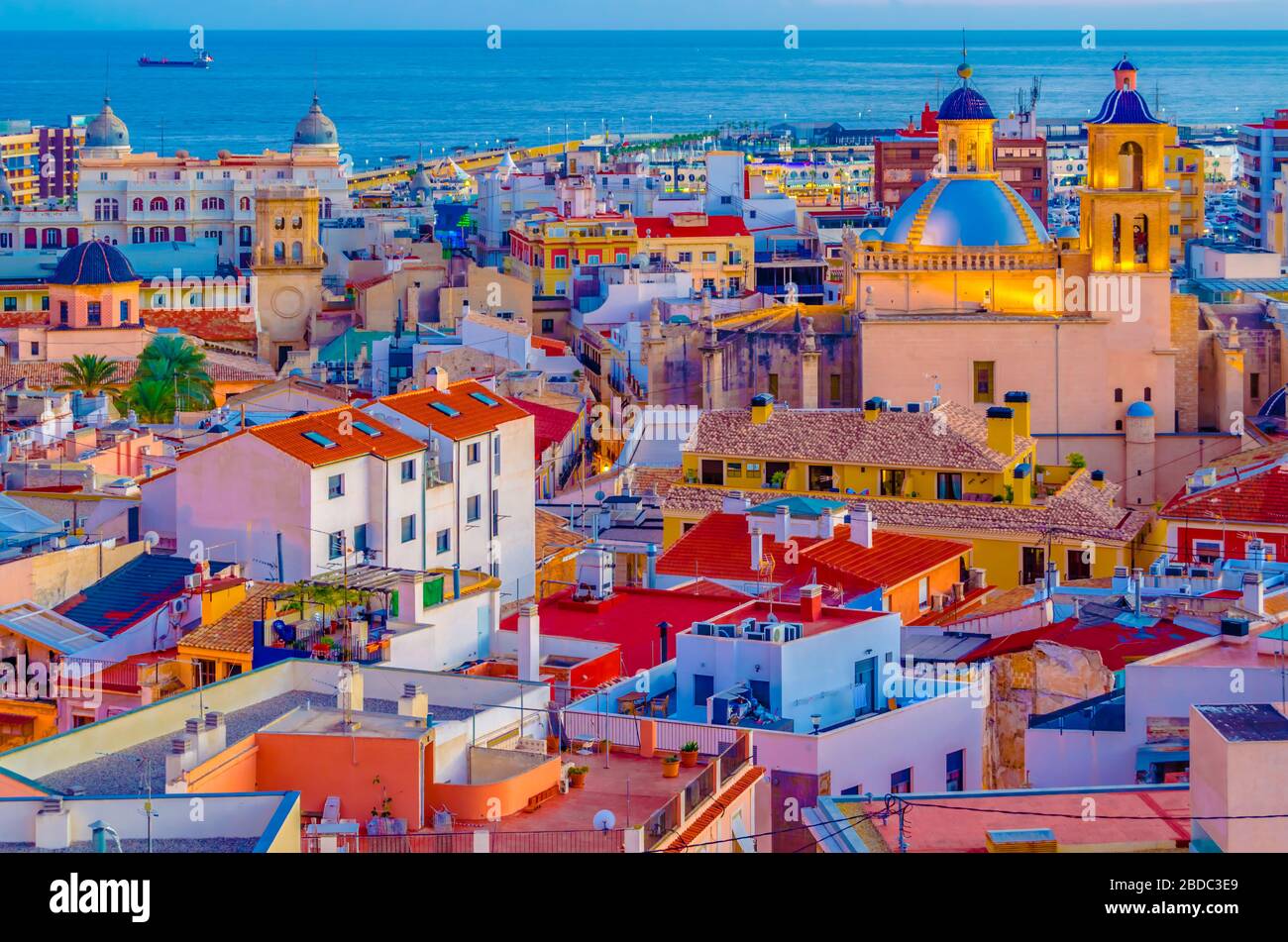 Alicante cityscape at dusk, showing the cathedral with the sea in the ...