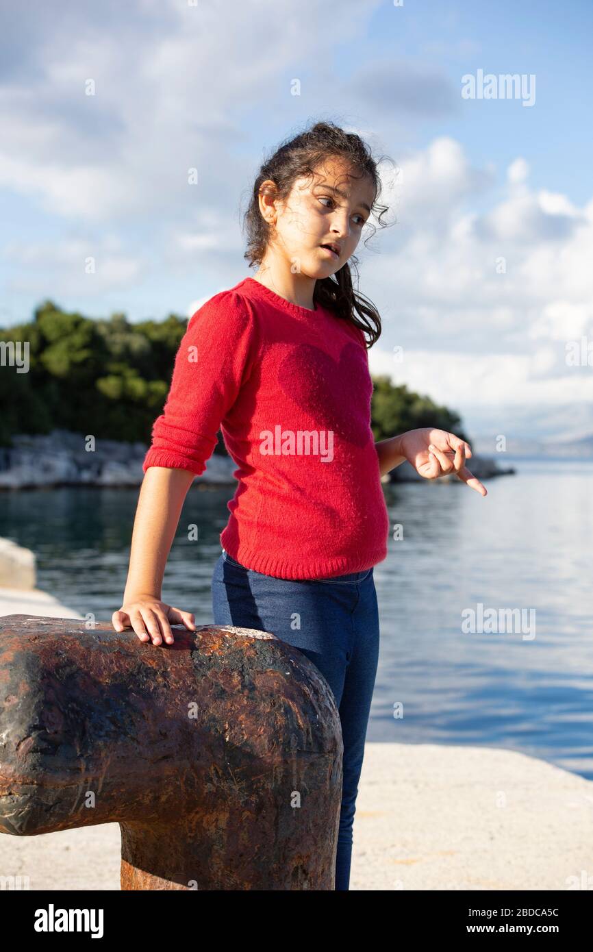 Corfu / Greece - Red dressed girl portrait, Seascape in background ...