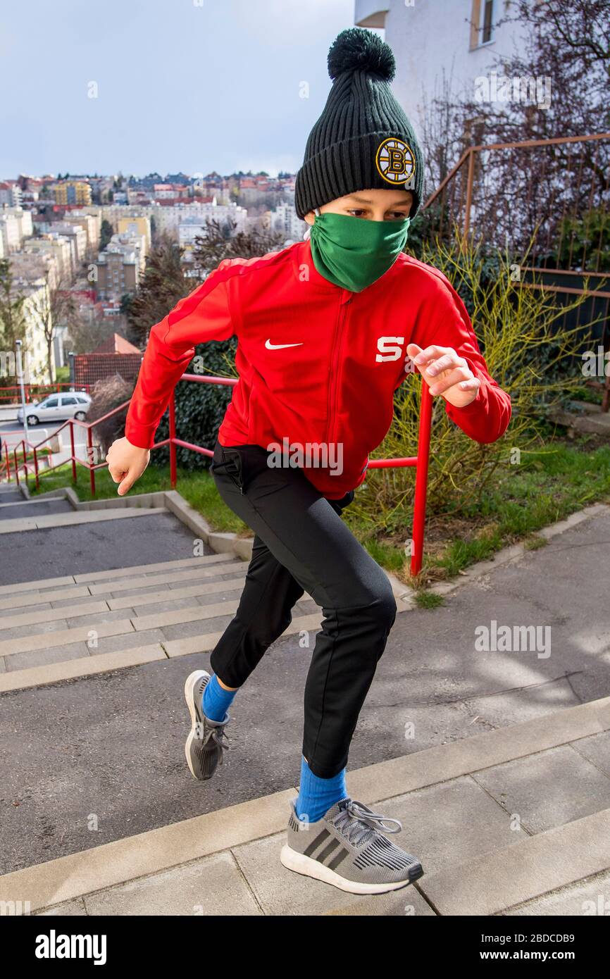 boy running upstairs with home made surgical mask Stock Photo - Alamy