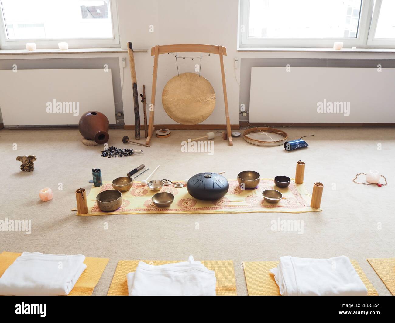 Instrument set up with yoga mats and cushions and blanket for a sound ...