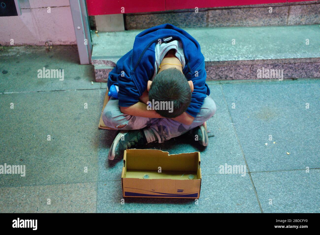 Child begging in streets hi-res stock photography and images - Alamy
