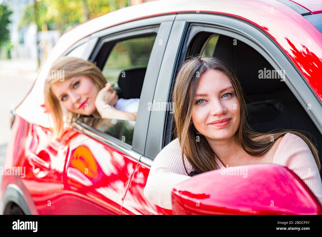 Girls going on road trip by car on summer day Stock Photo - Alamy