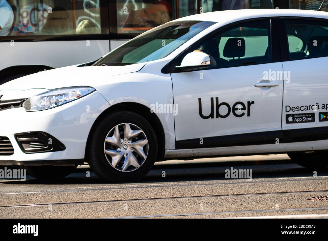 Uber car in traffic, modern city taxi service. Car pollution, traffic ...