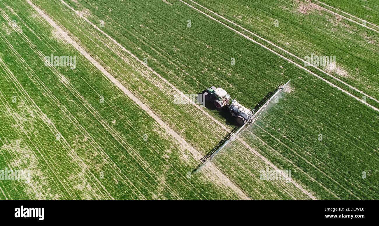 Agriculture Tractor Working in Field Stock Photo - Alamy