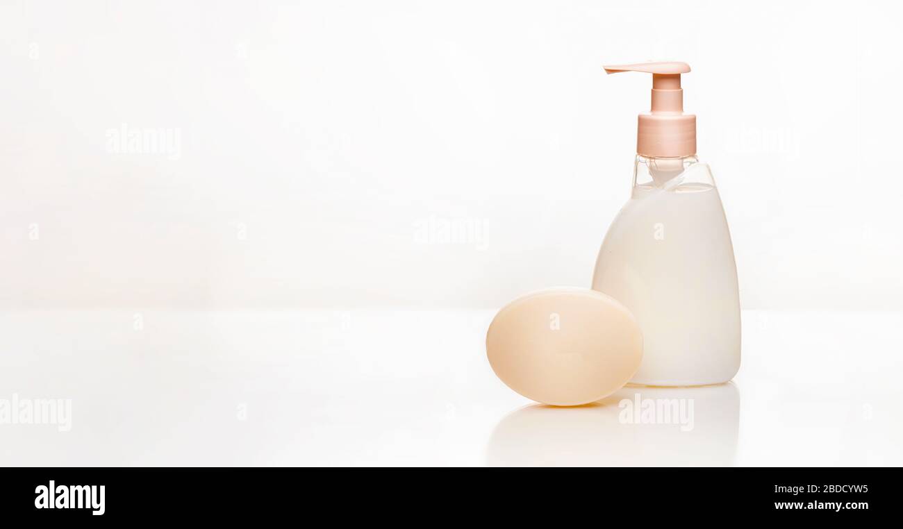 hygiene and disinfection. soap and cream soap or shampoo on a white ...
