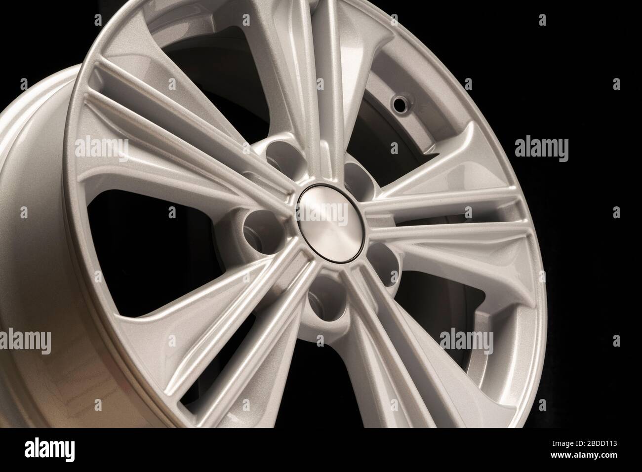 new aluminum alloy wheel, silver color on a black background Stock ...