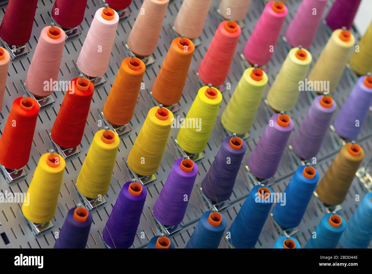 Colorful embroidery thread rolls for sewing machine. Industry Stock ...