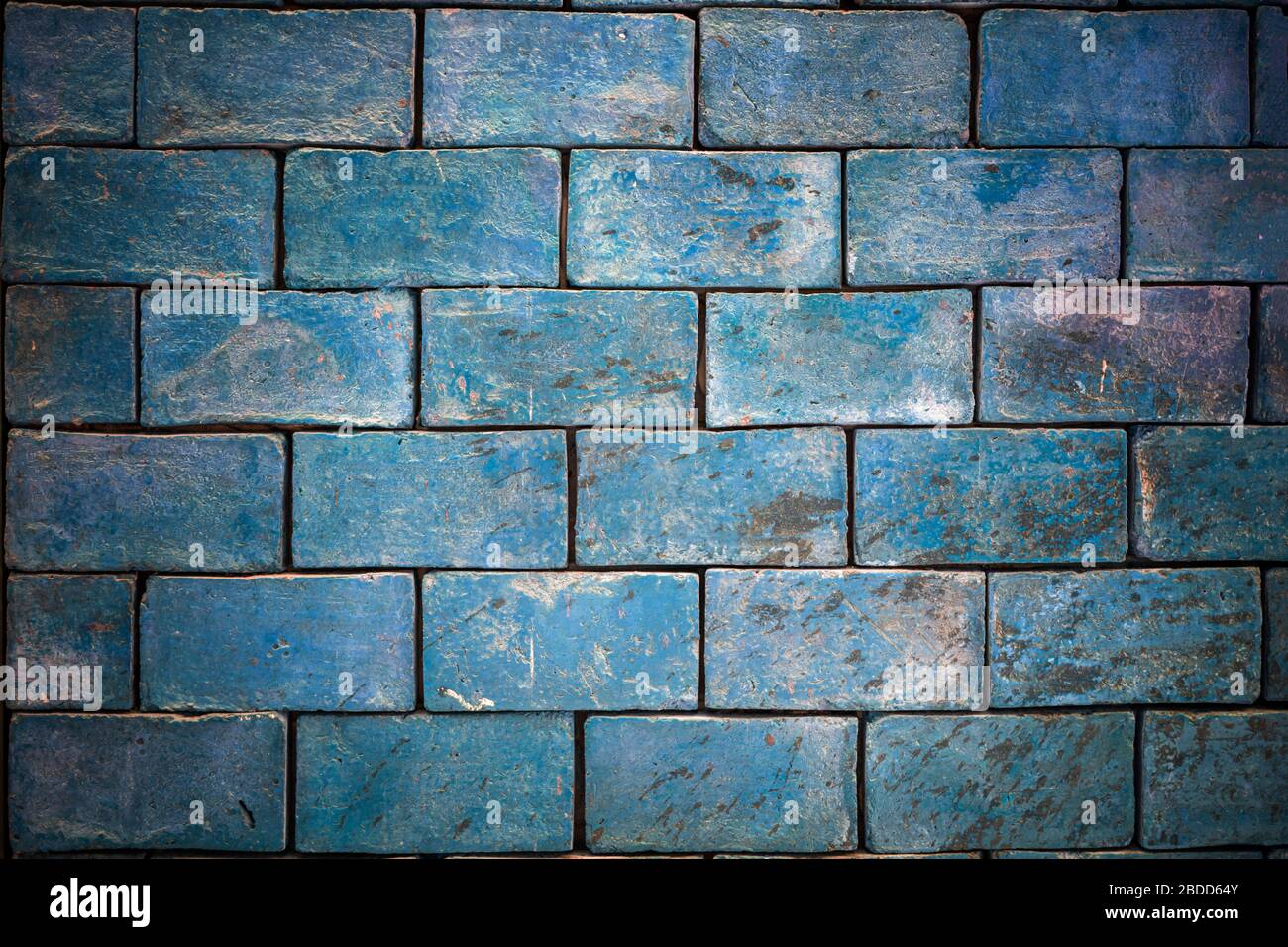 Texture background, light blue brick wall. splashes and scratches ...