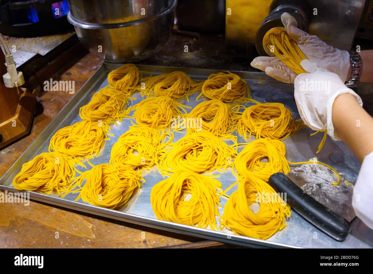making fresh organic macaroni. Spaghetti macaroni variety is made Stock ...