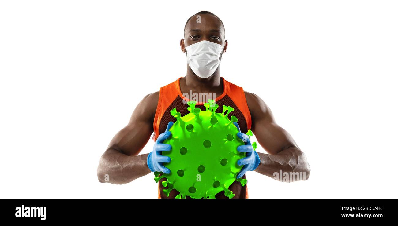 Beat the disease. Sportsman basketball kicking, punching coronavirus ...