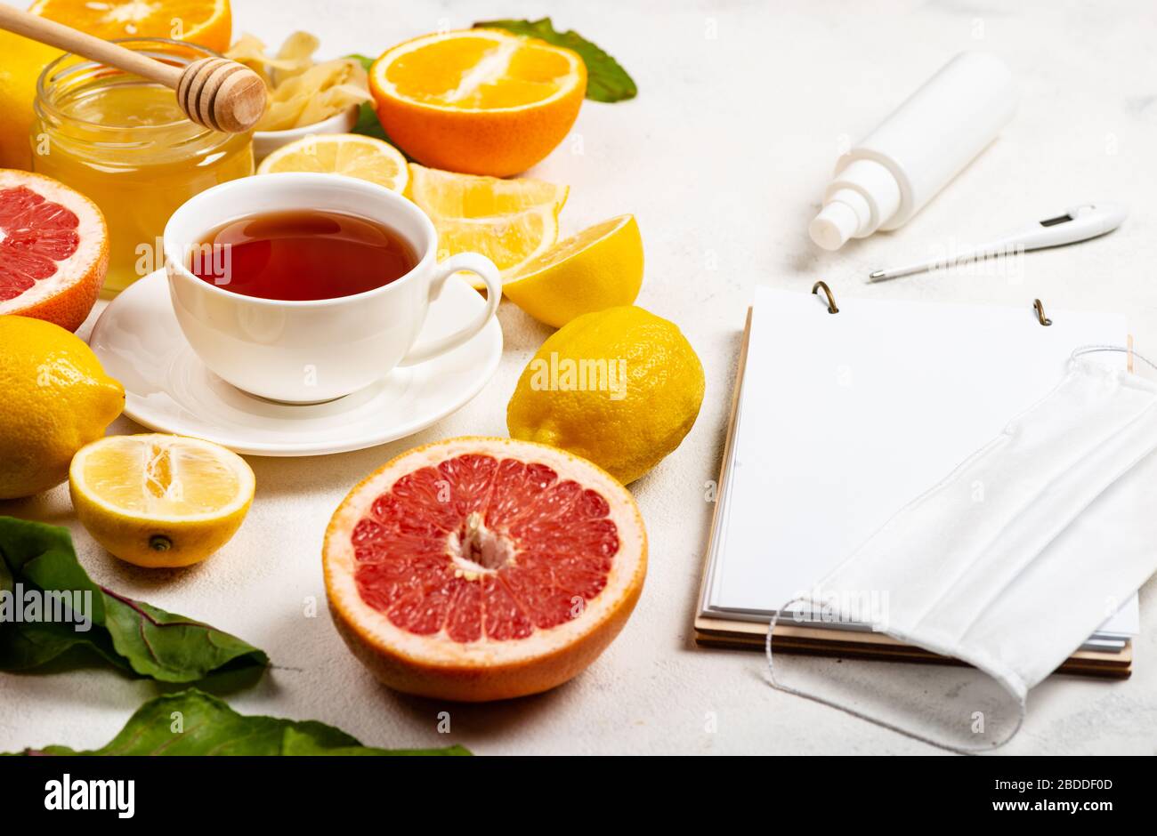 Food for immunity boosting , notebook with place for text, cup of tea ...