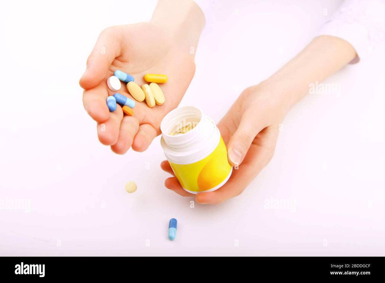 Pills, tablets, vitamins, drugs, capsules in hand isolated on white ...