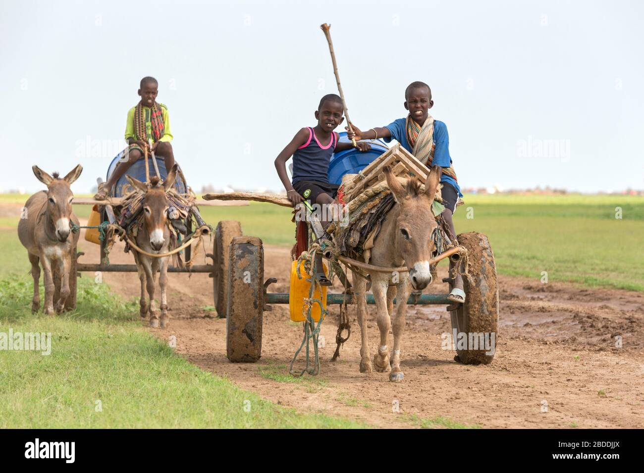 African children fetch water hi-res stock photography and images - Alamy