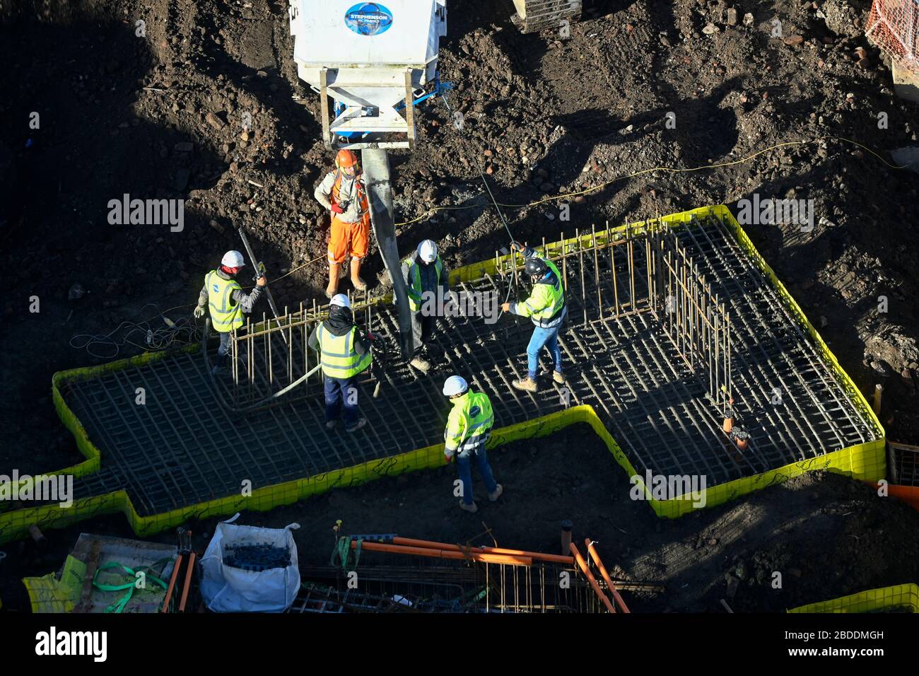 Construction workers on building site England Stock Photo - Alamy