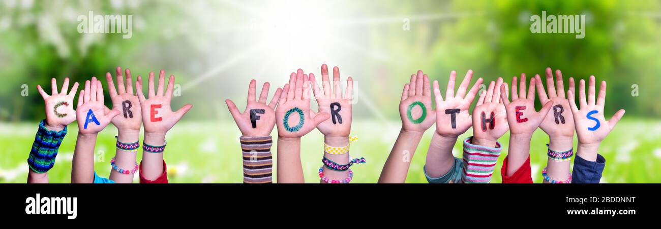 Children Hands Building Word Care For Others, Grass Meadow Stock Photo ...