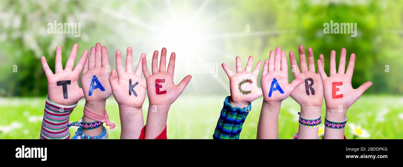 Children Hands Building Word Take Care, Grass Meadow Stock Photo - Alamy