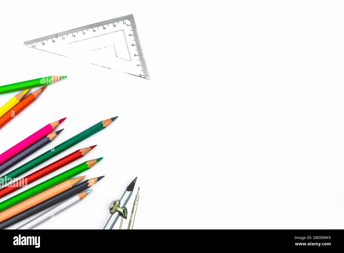 Compass attached to a pencil ,a plastic triangle and some different ...