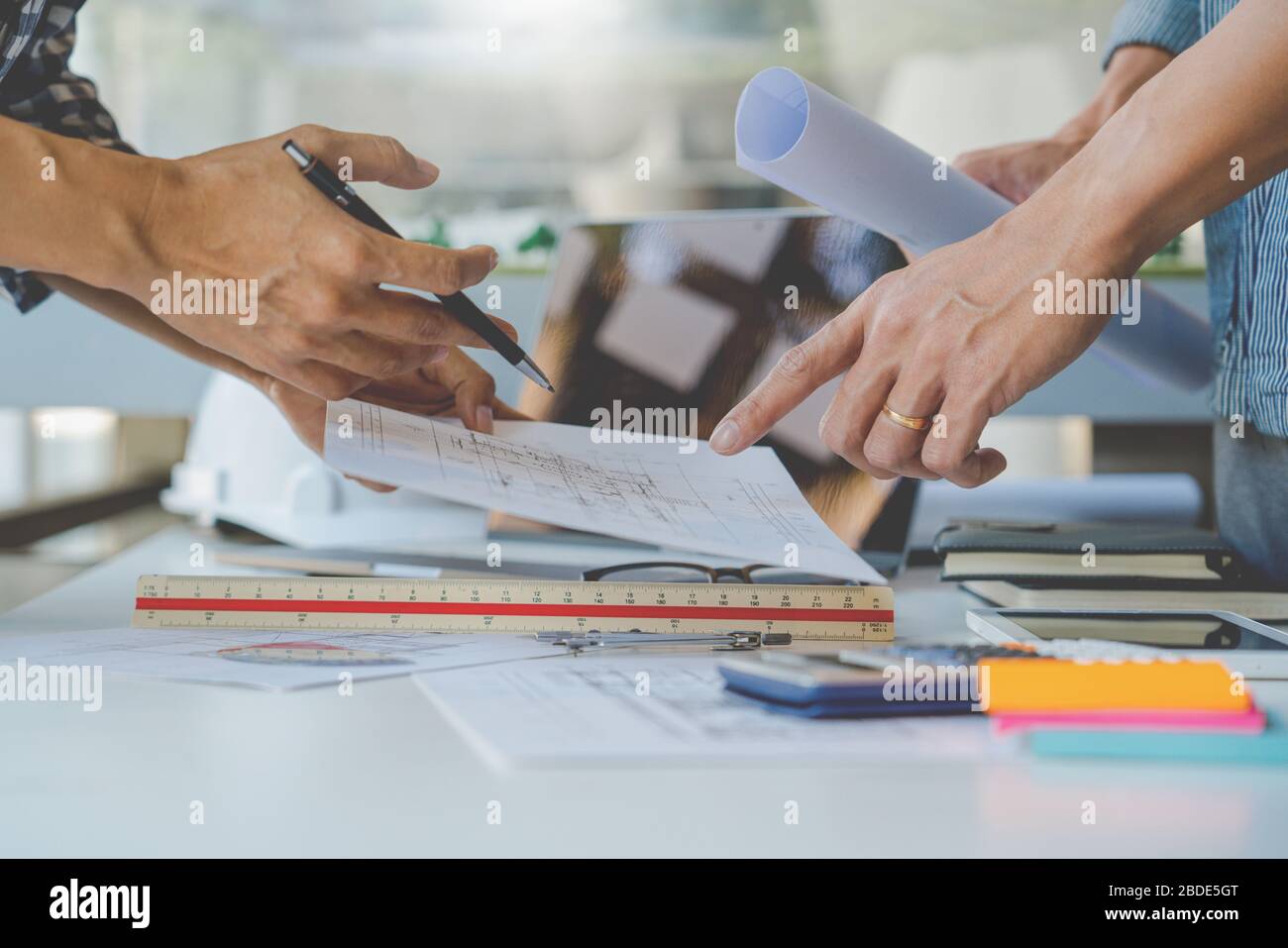 engineer Hand Drawing Plan On Blue Print with architect equipment ...