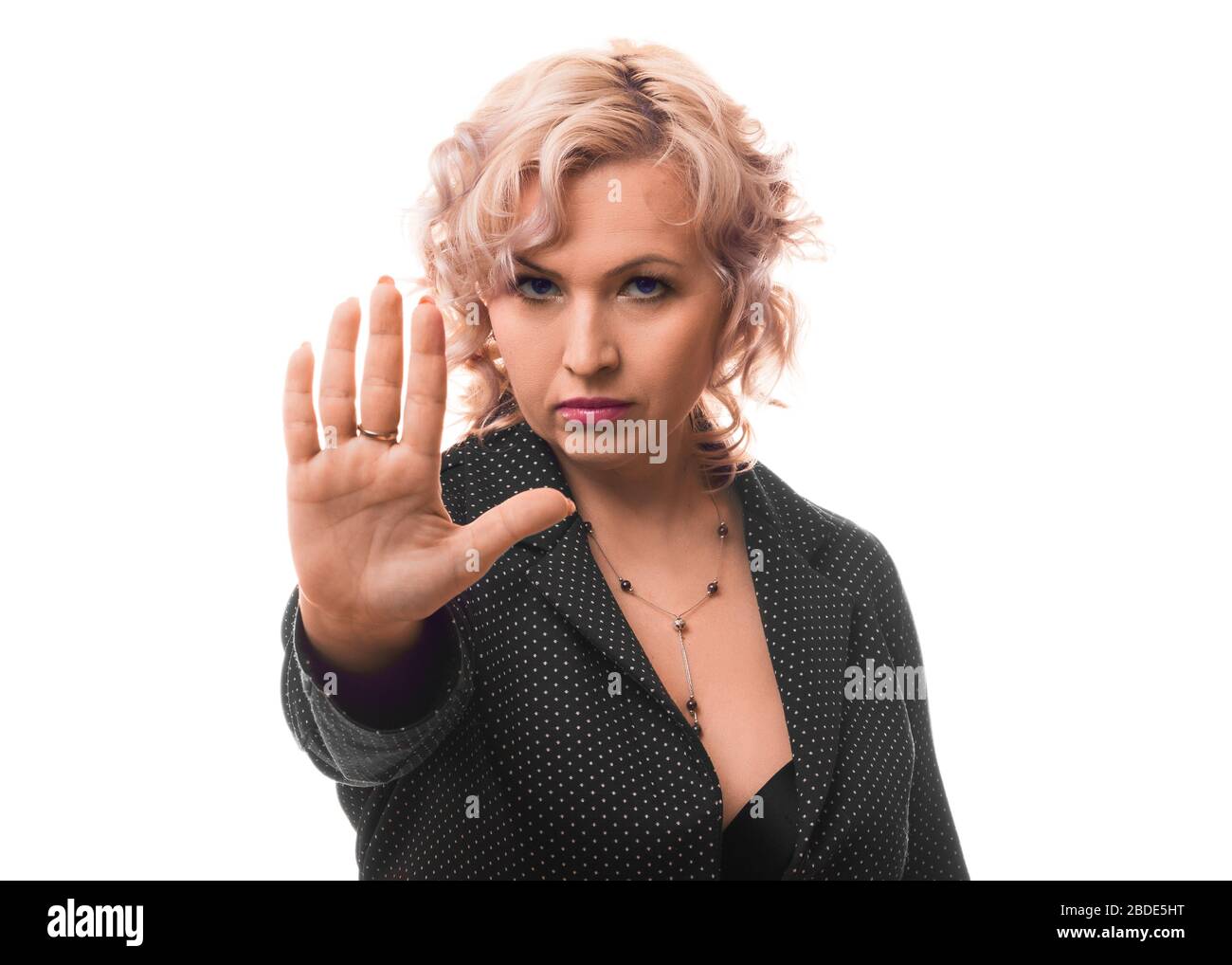 Middle aged businesswoman showing stop sign with palm of hand. Isolated ...