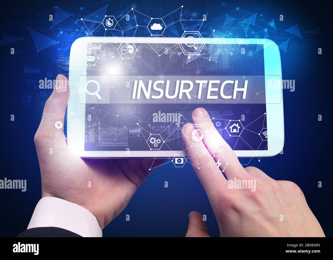 Close-up of a tablet searching INSURTECH inscription, hi-tech computing ...