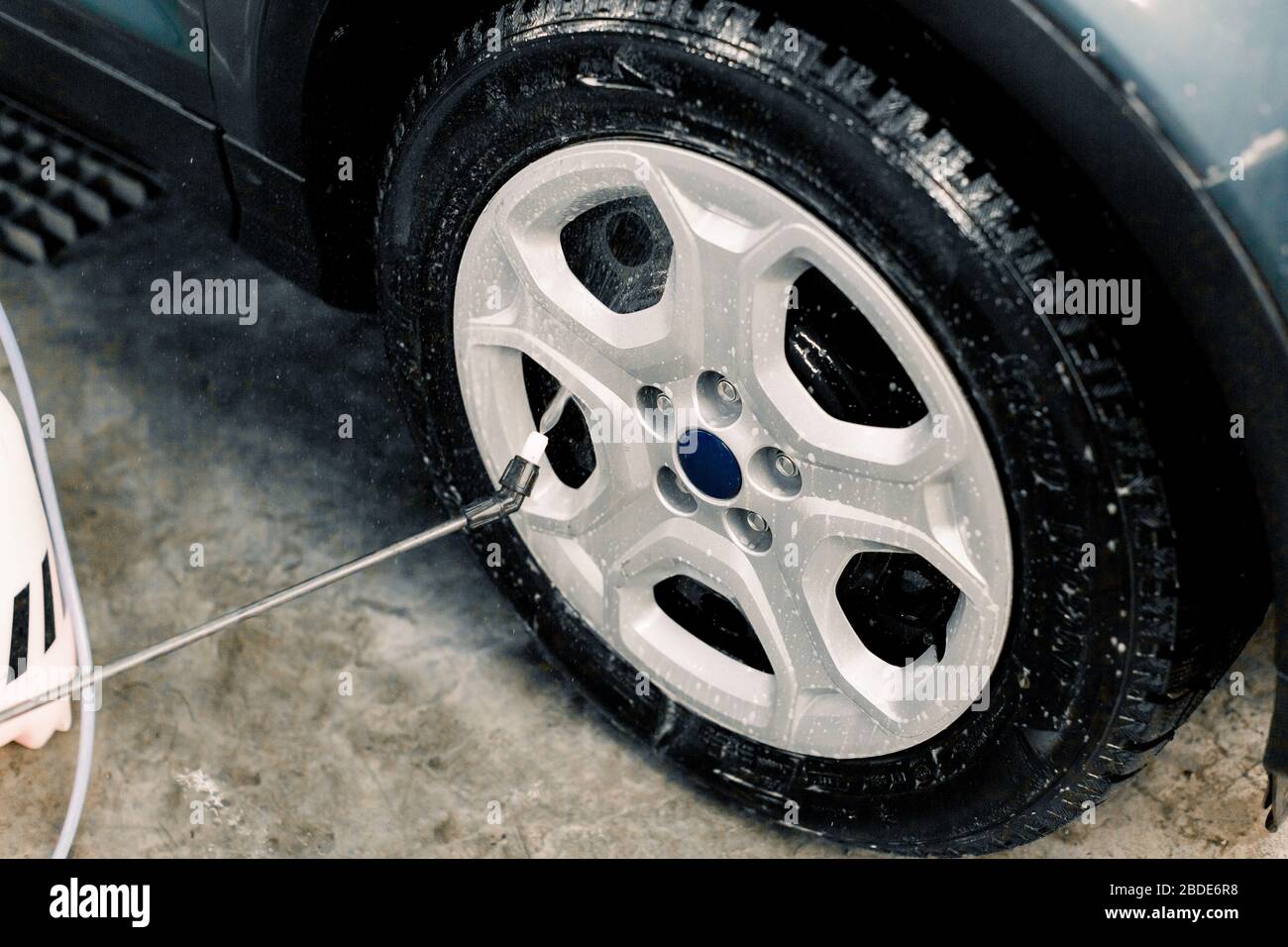Car wheel washing, detailing concept. Cropped close up image of car ...