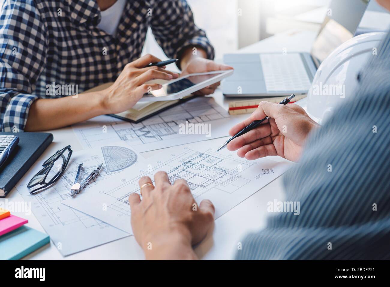 engineer Hand Drawing Plan On Blue Print with architect equipment ...