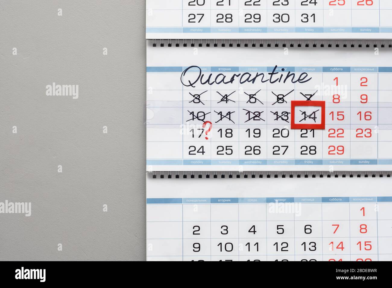 Calendar on a white wall with the inscription quarantine and crossed ...