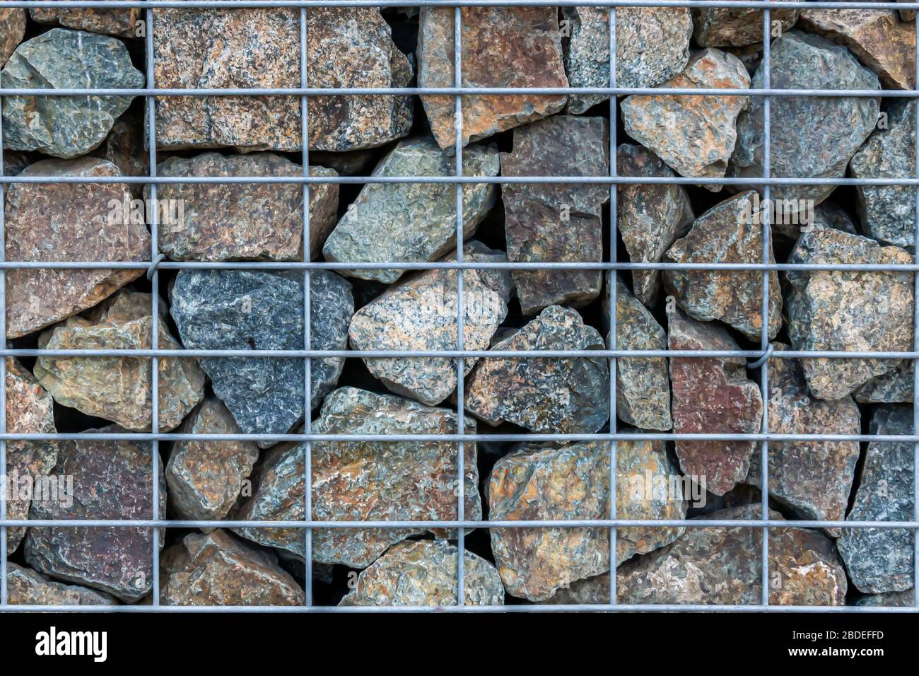 texture background - rock behind the grid, wall Stock Photo - Alamy