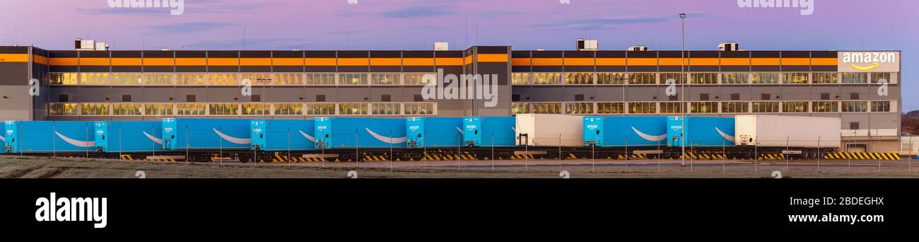 semi-trailers with containers with the Amazon logo in the parking lot ...