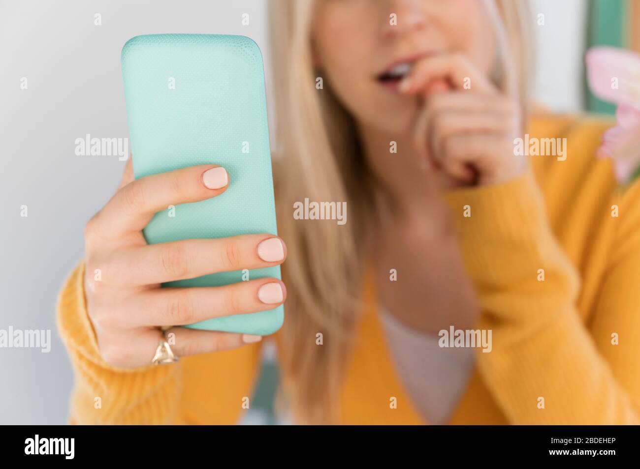 Woman nail biting anxious hi-res stock photography and images - Alamy