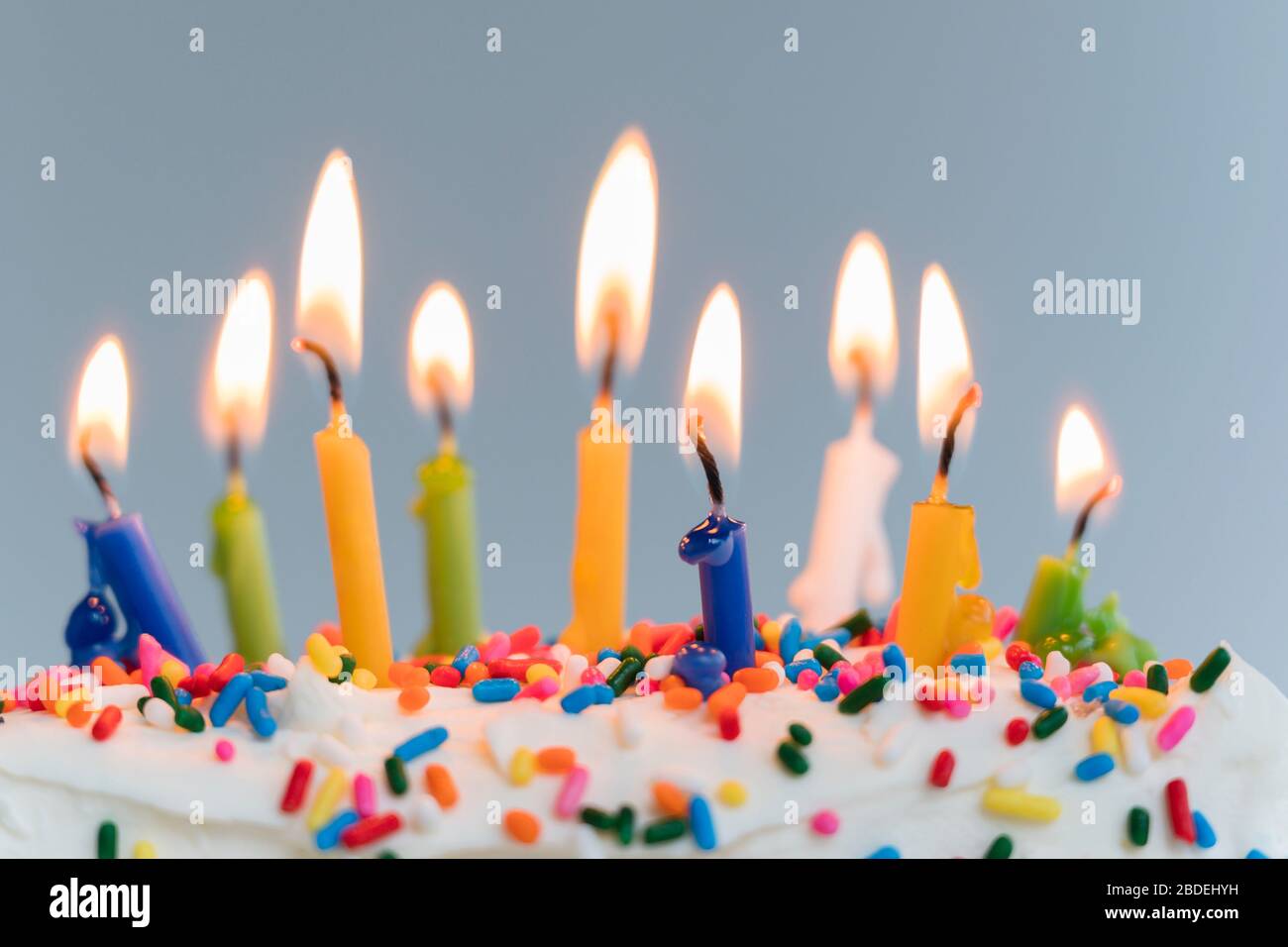 Birthday cake with candles lit hi-res stock photography and images - Alamy