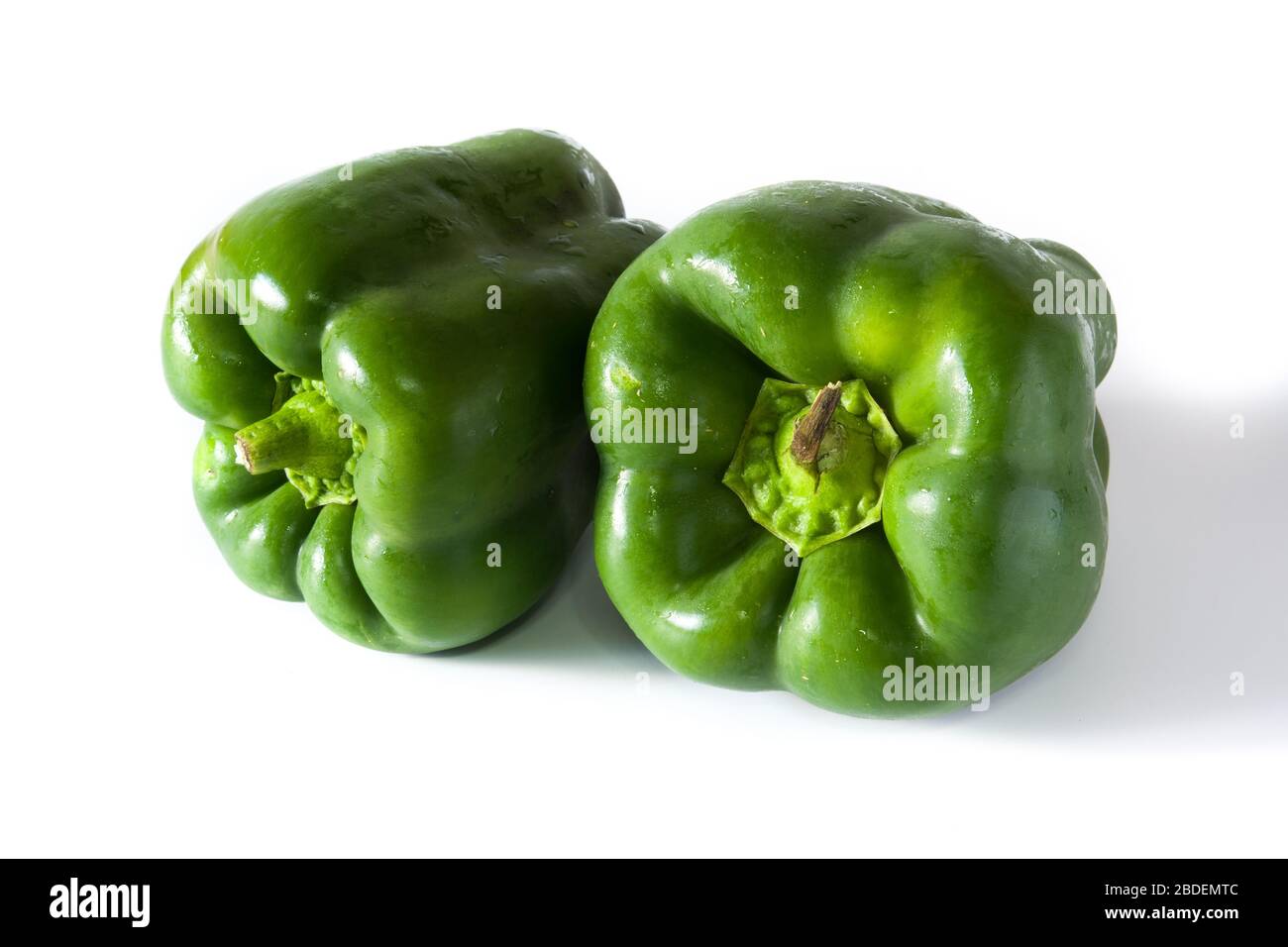 Fresh green peppers isolated on white background Stock Photo - Alamy